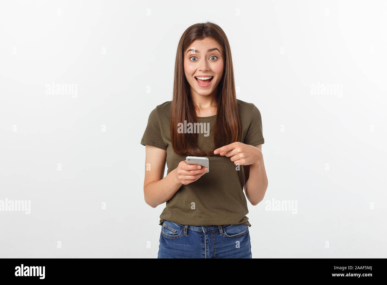 Laughing woman talking and texting on the phone isolated on a white ...