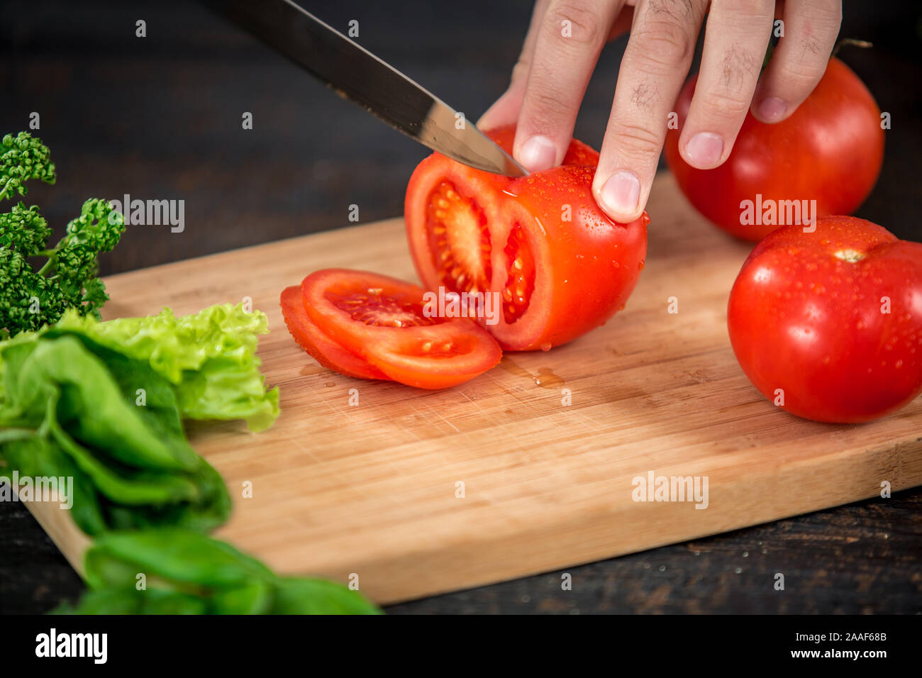 Male hands cutting vegetables for salad Stock Photo - Alamy