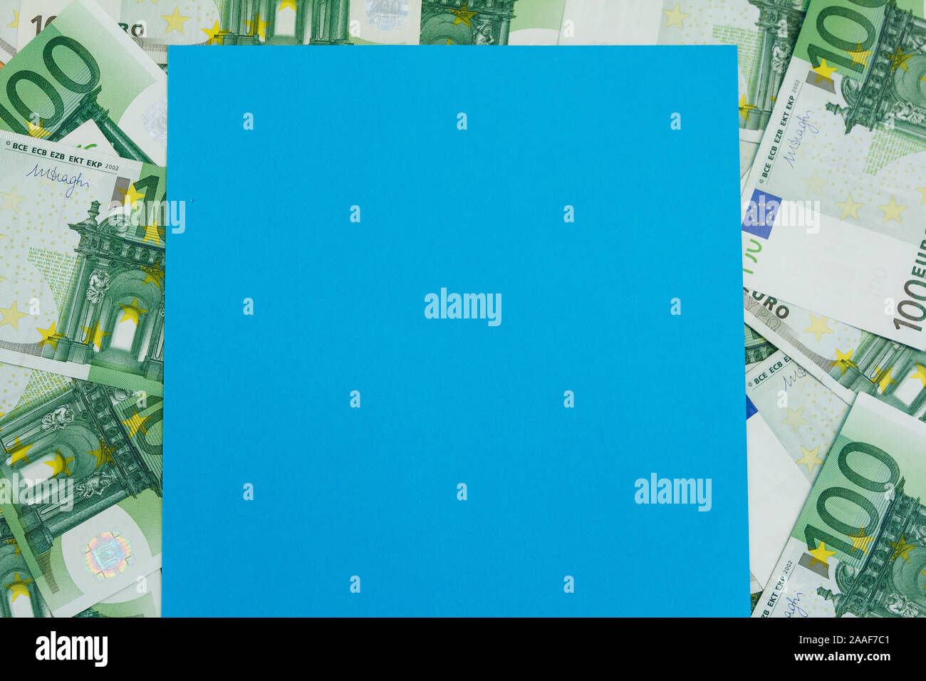 Many Banknotes of 100 Euro with blue copy space, the European currency ...
