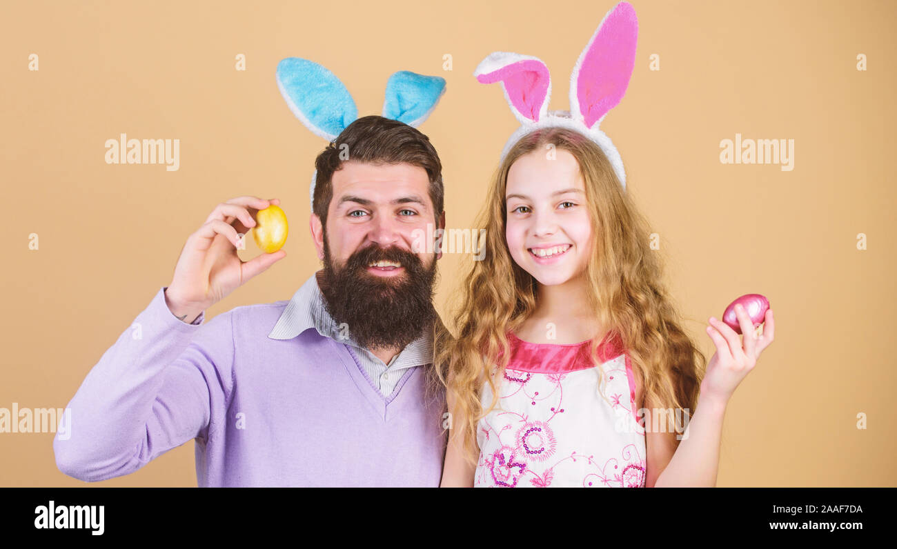 Looking for egg. Family of father and daughter smiling in Easter bunny ...