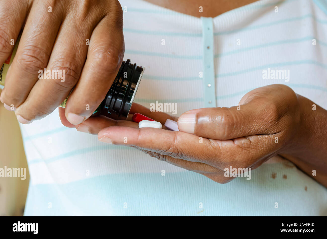 Tablets In hand Stock Photo - Alamy
