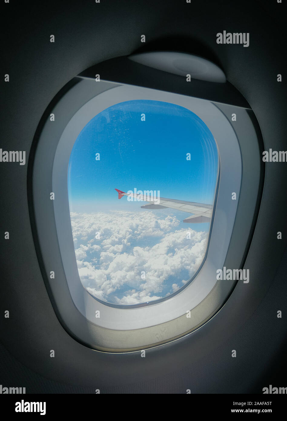 Aiplane windows view on aircraft wing from the cabin, skyline ...