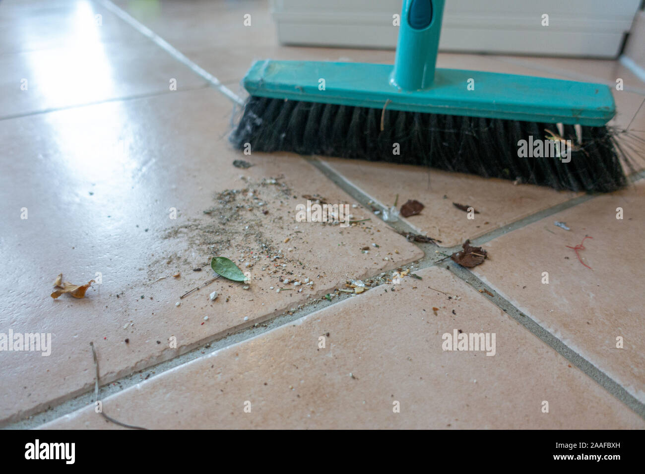 dirt swept with a broom is lying on the floor Stock Photo - Alamy