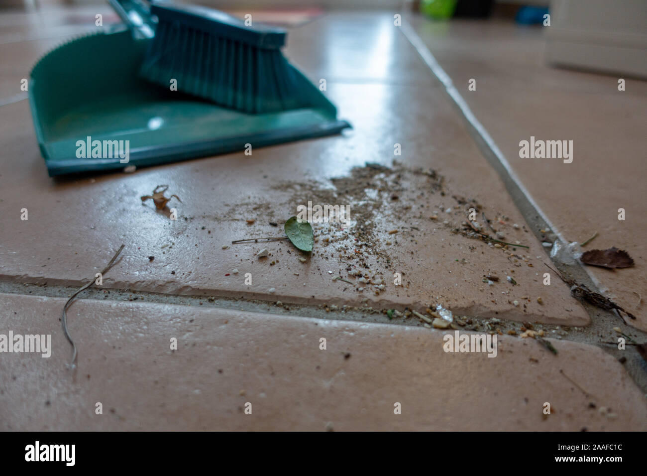 dirt swept with a broom is lying on the floor Stock Photo - Alamy
