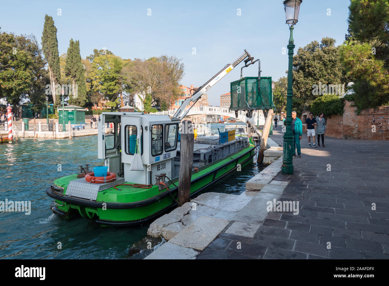 Garbage collector boat in Venice, Italy Stock Photo - Alamy