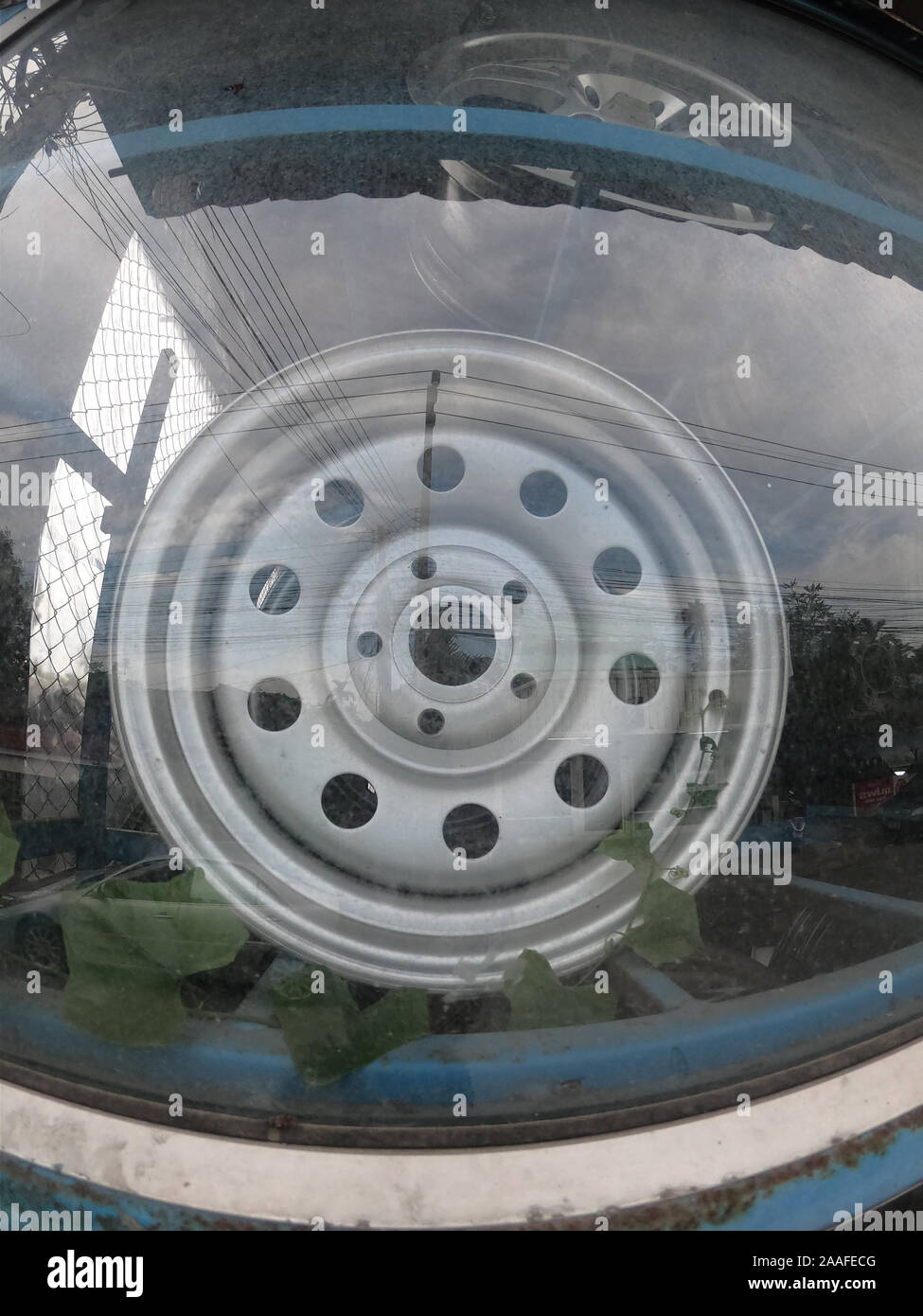 Metal Car Wheel Rim under the glass in store Stock Photo - Alamy