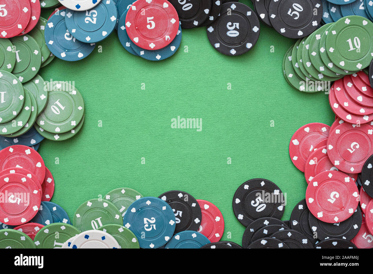 Poker chips border frame on green flat lay background with copy space ...