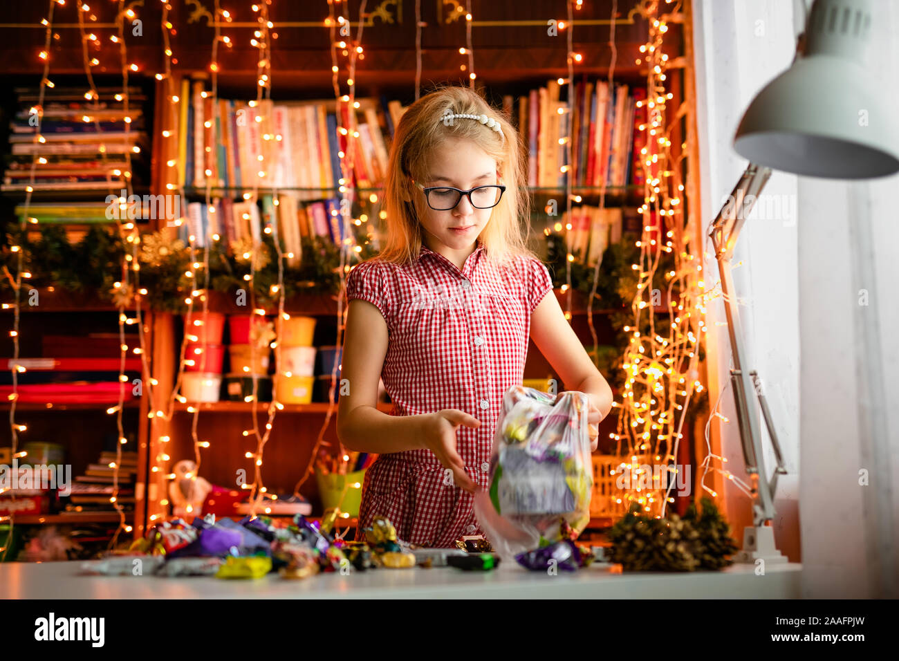 Children opening Christmas presents. Little girl and boy with present ...