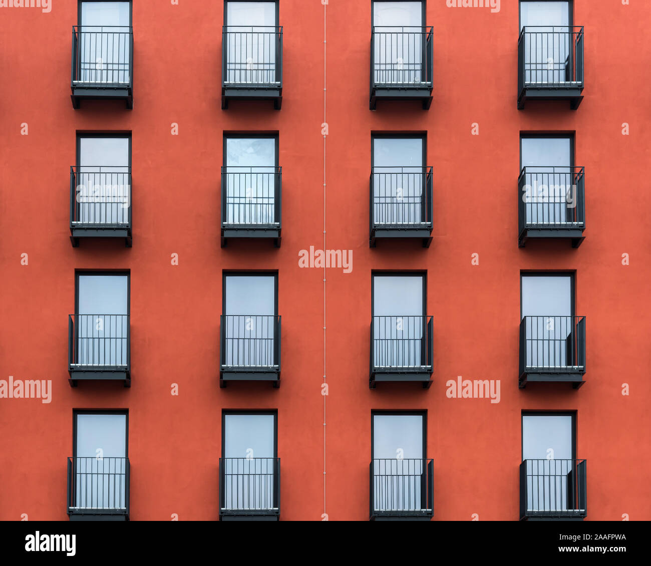 Front of a new red residential house with black balconies Stock Photo ...