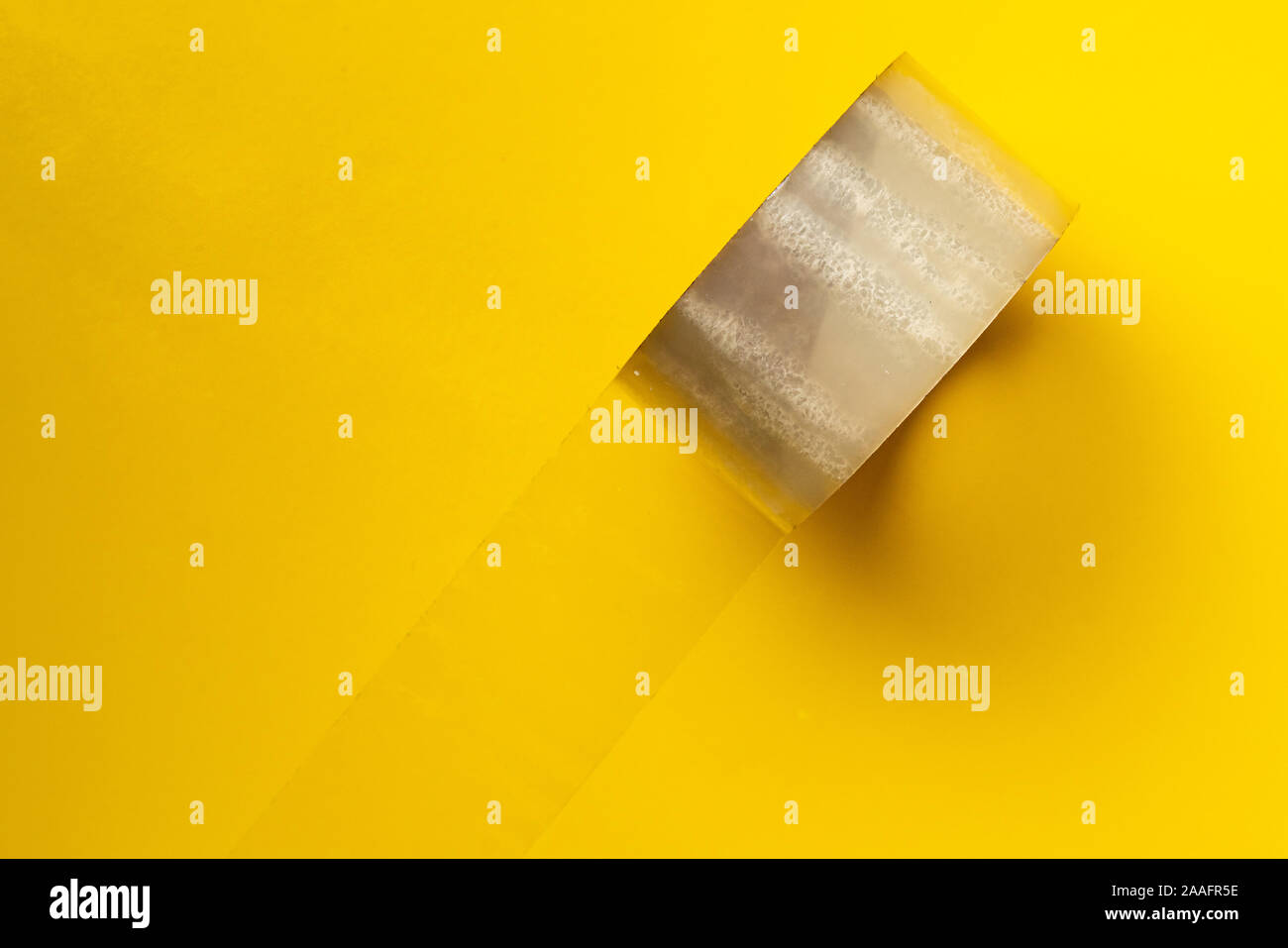 Yellow parcel tape hi-res stock photography and images - Alamy
