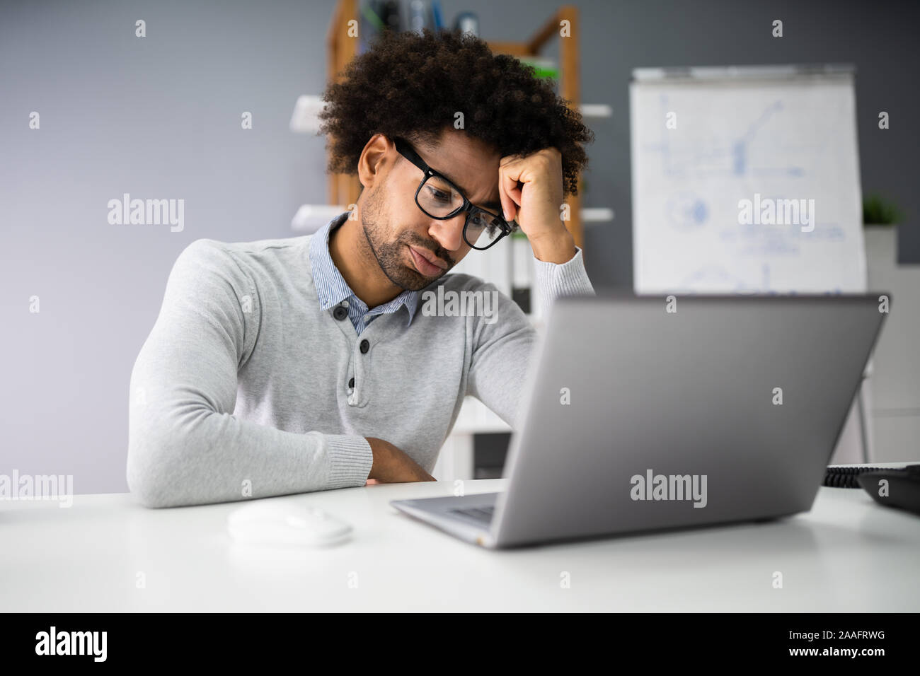 African man headache working on hi-res stock photography and images - Alamy