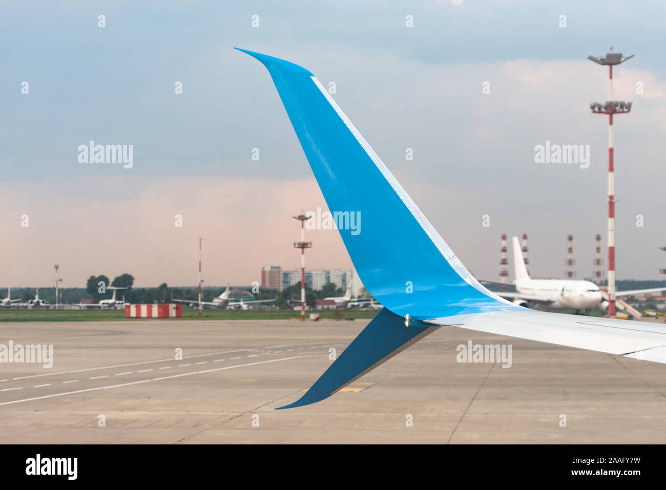 Vnukovo airport, Moscow. Blue wing tip. The wing of the aircraft on the ...