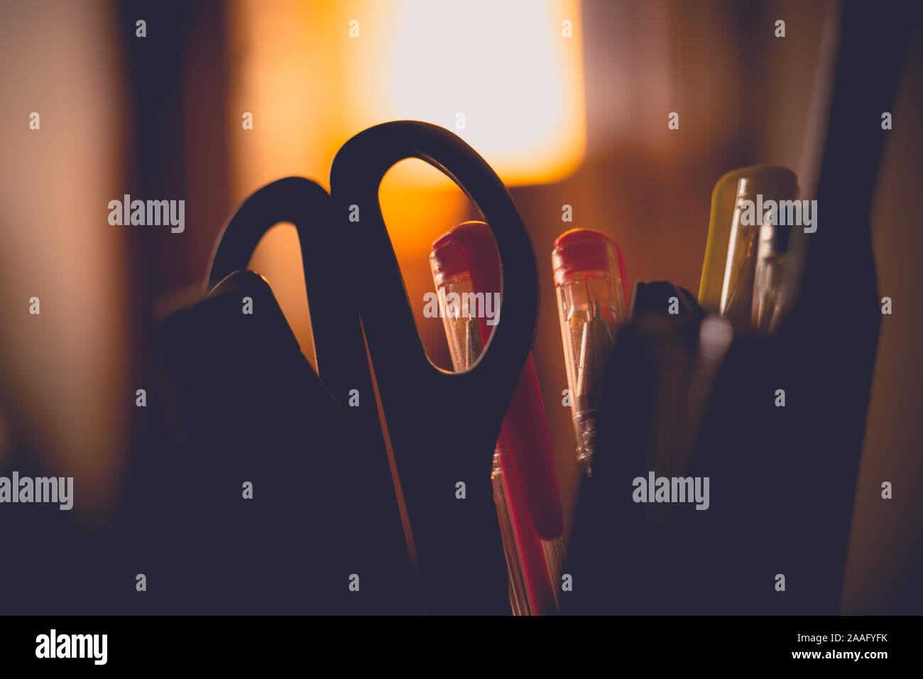 Stationery set of pencils and scissors in a stand Stock Photo - Alamy