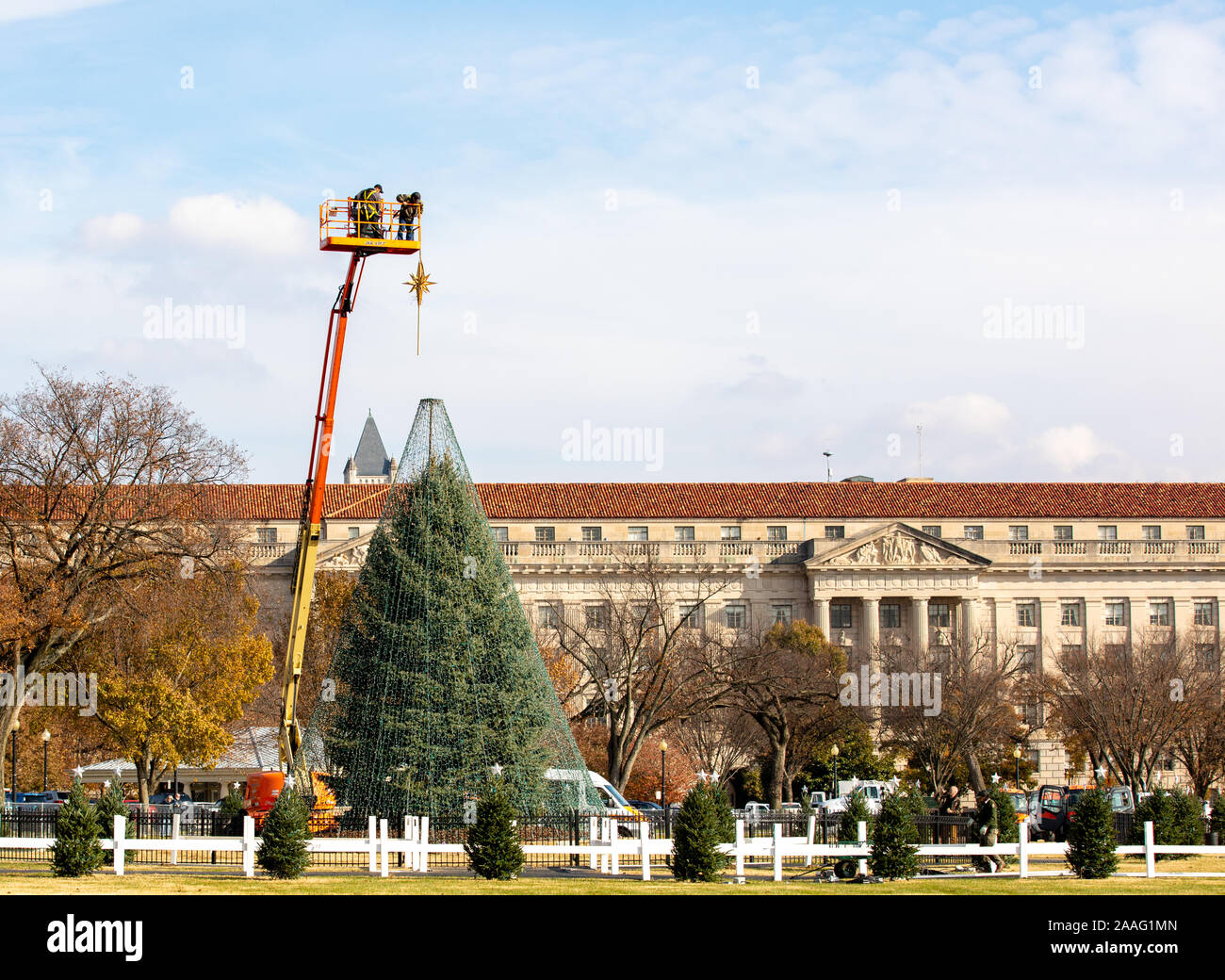 Putting the star on the Christmas tree in the Ellipse in front of the ...