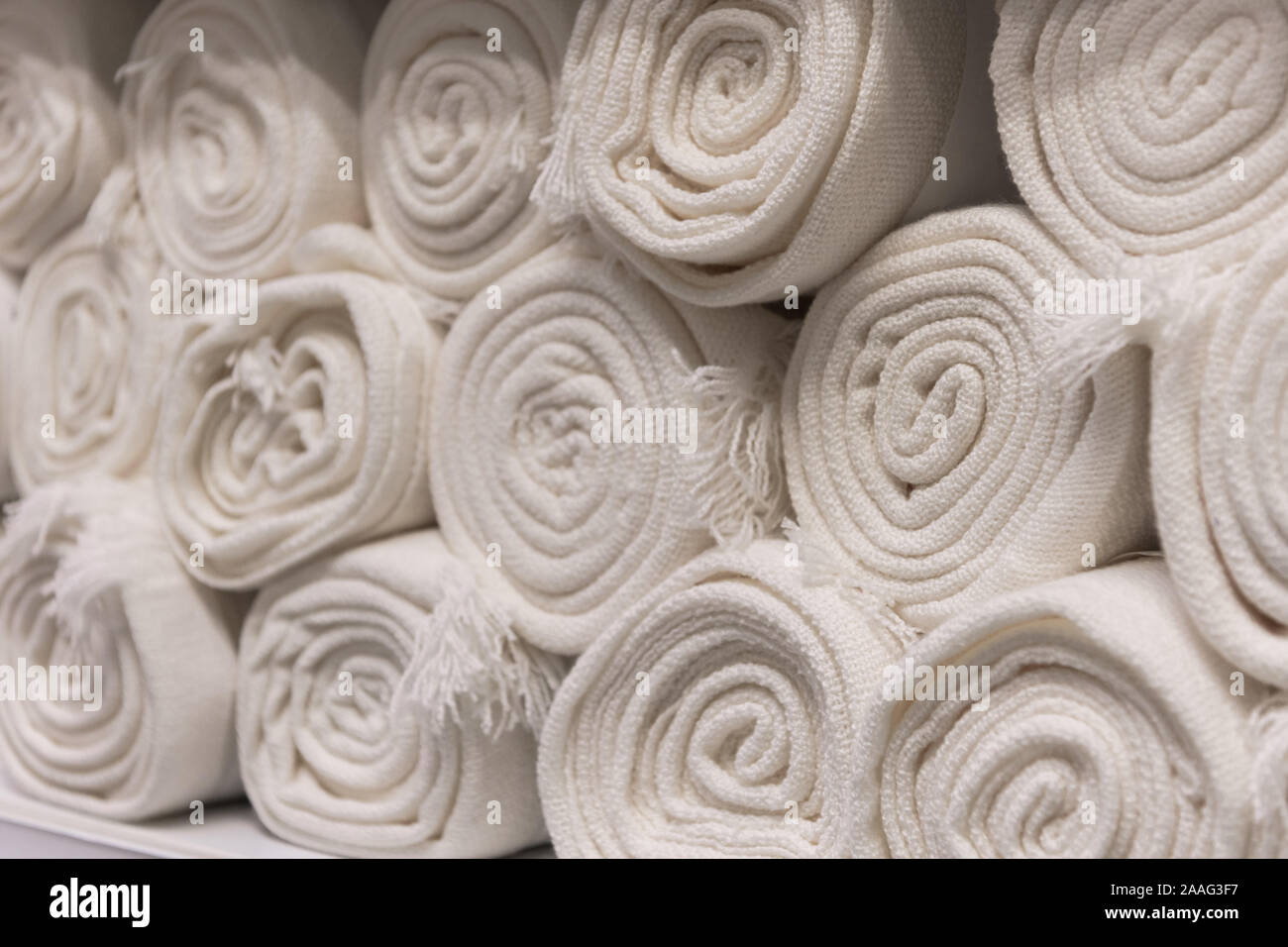 Roll the fabric folded beautifully in the textile shop Stock Photo - Alamy
