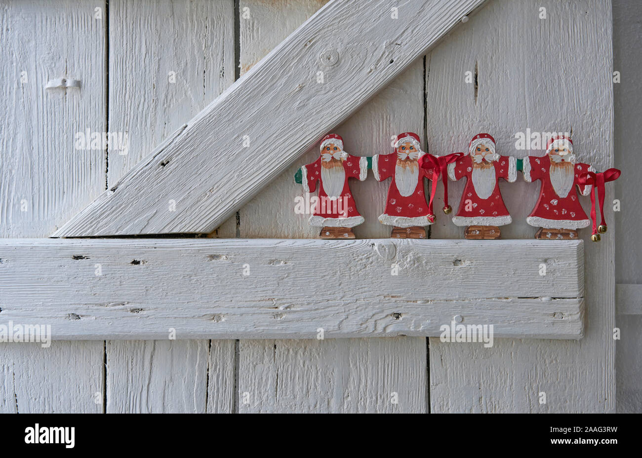 Close up of group of father christmas nicely decorated on a white ...