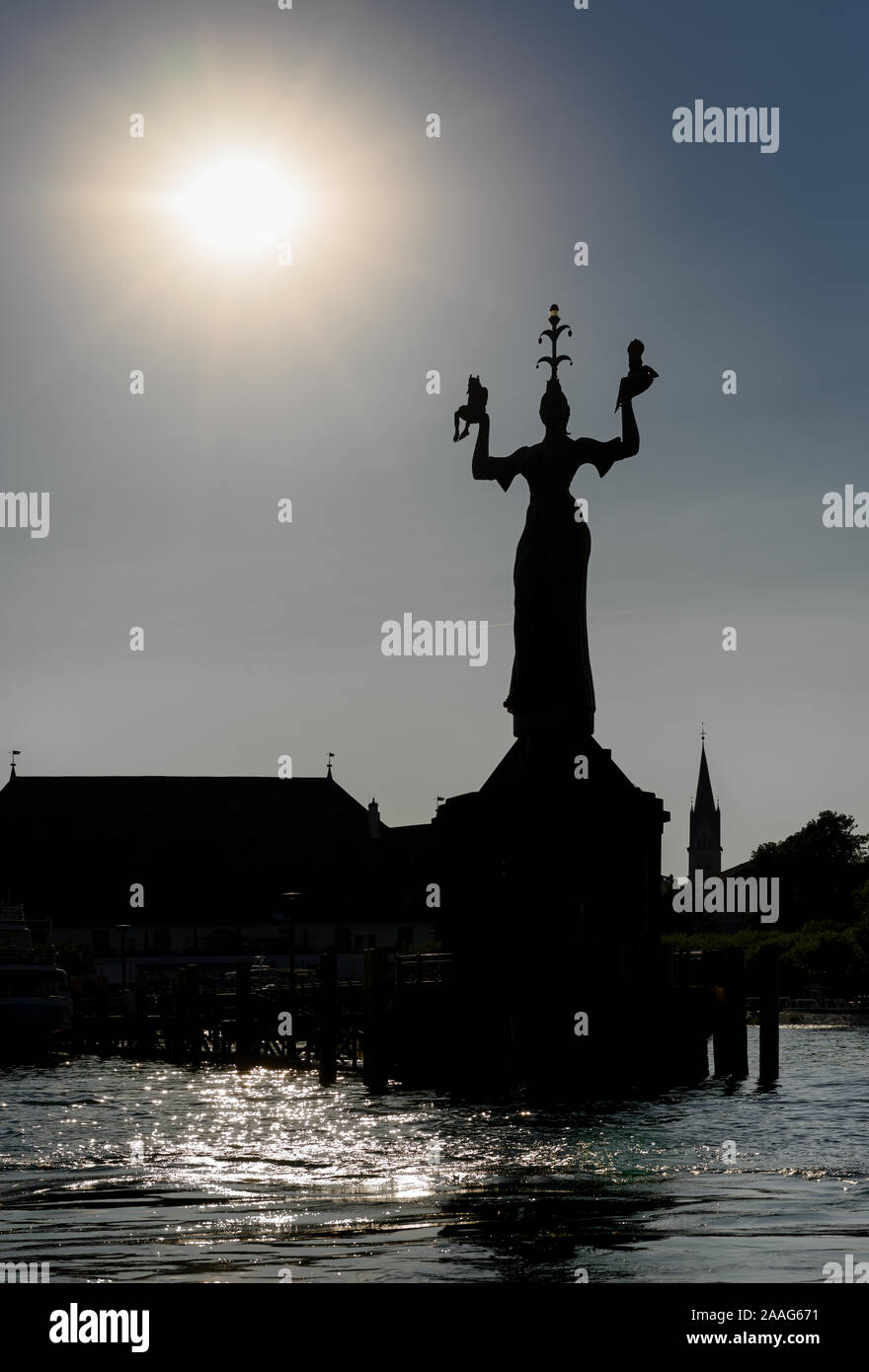 Imperia statue at port entry in front of constance city skyline, famous ...
