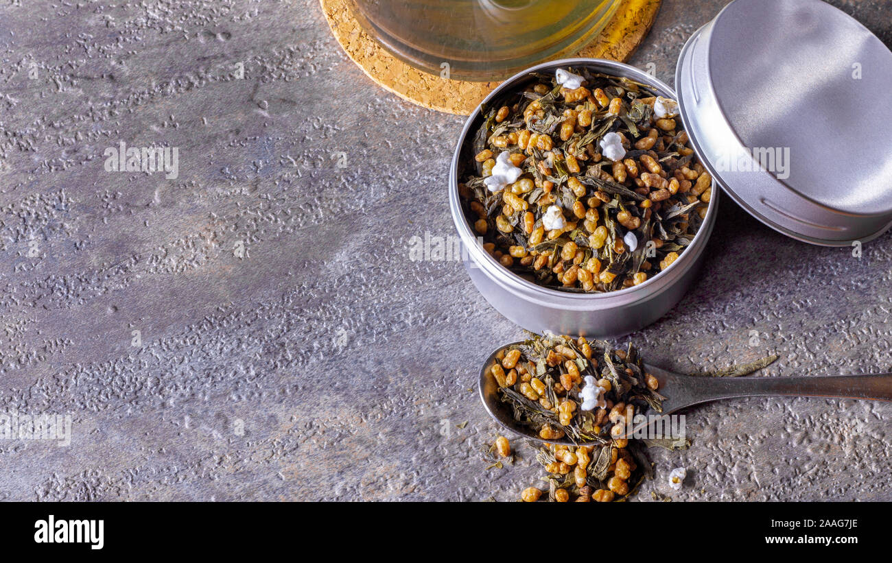 Organic and natural brown rice tea, genmaicha in a container ...