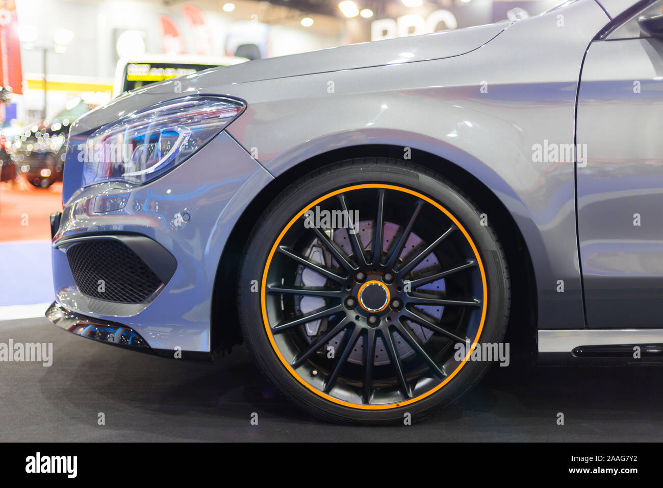 Car wheel close-up with modern style car and luxury body Stock Photo ...