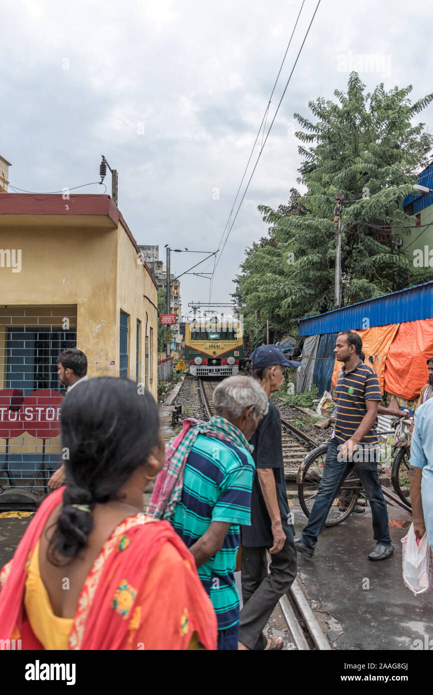 City Local train of the Indian Railways moving with passengers within ...