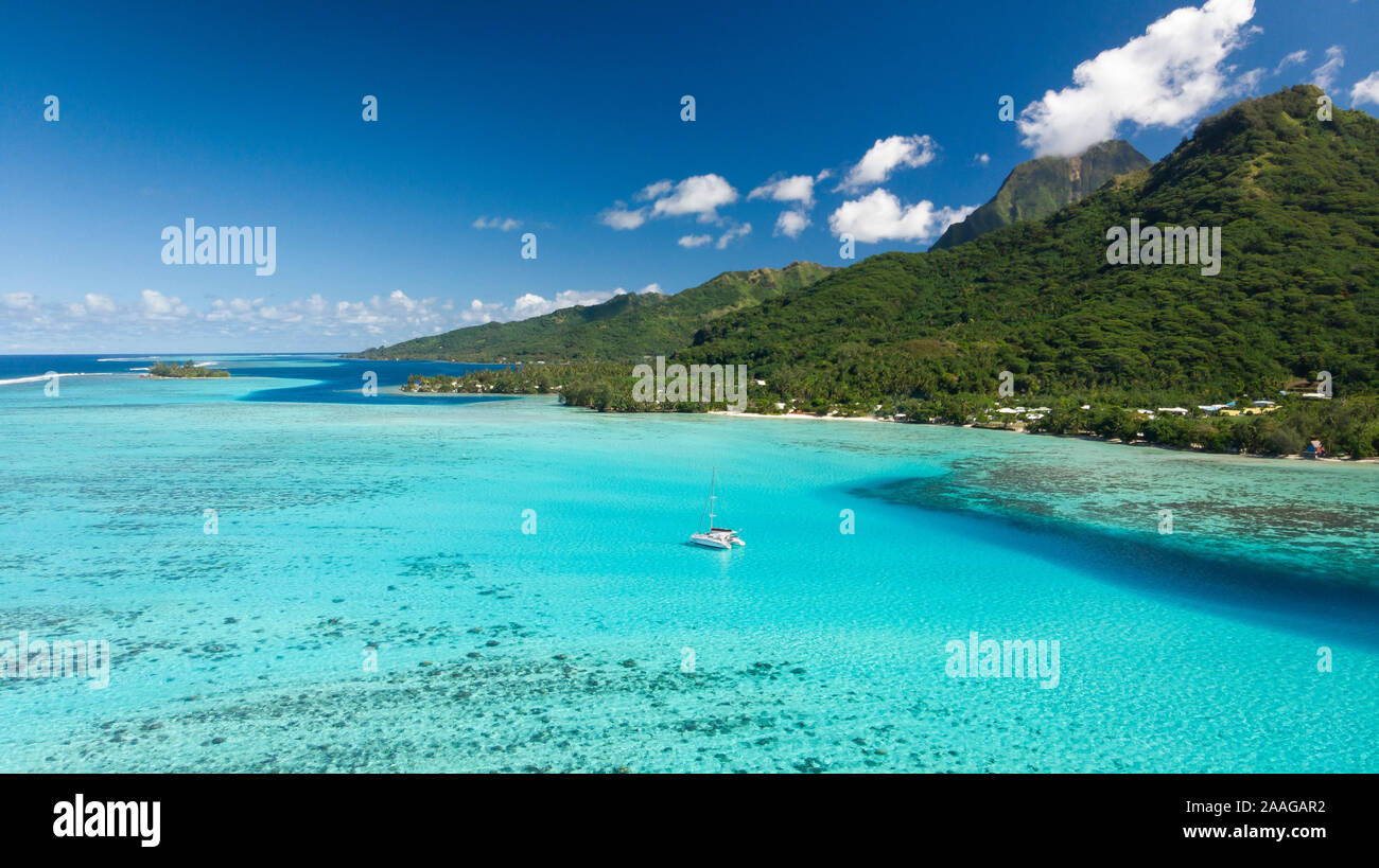 Sailing boats anchorage in the south of the lagoon of Moorea in French ...