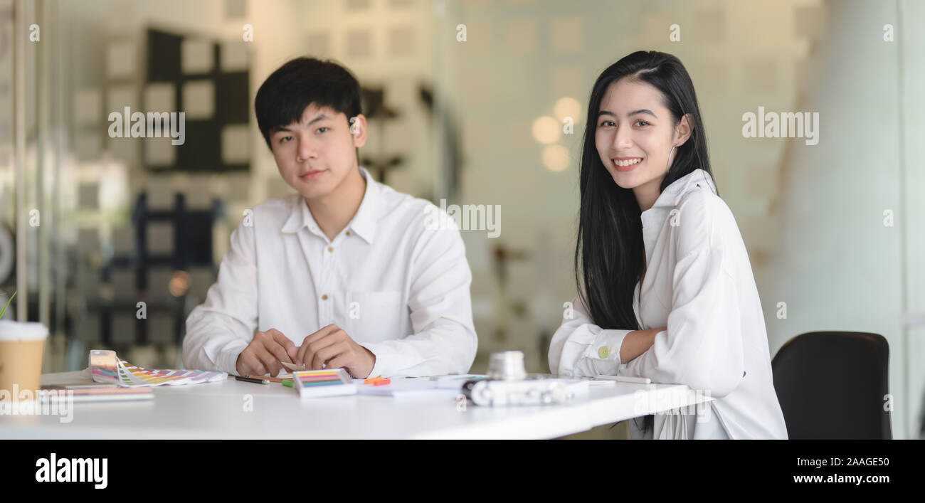 Portrait of two professional designer working on their project together ...