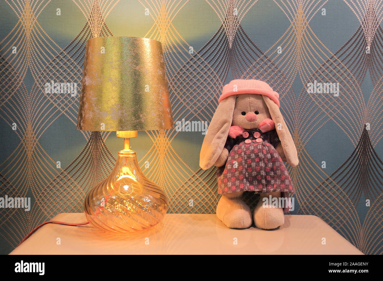 Yellow night light with plush toy in a children's room Stock Photo - Alamy