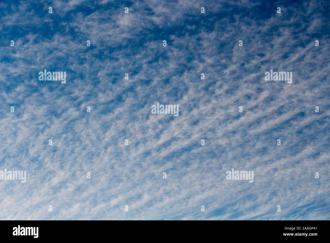 Hazy high clouds with some cumulostratus and cirrus formations on an ...