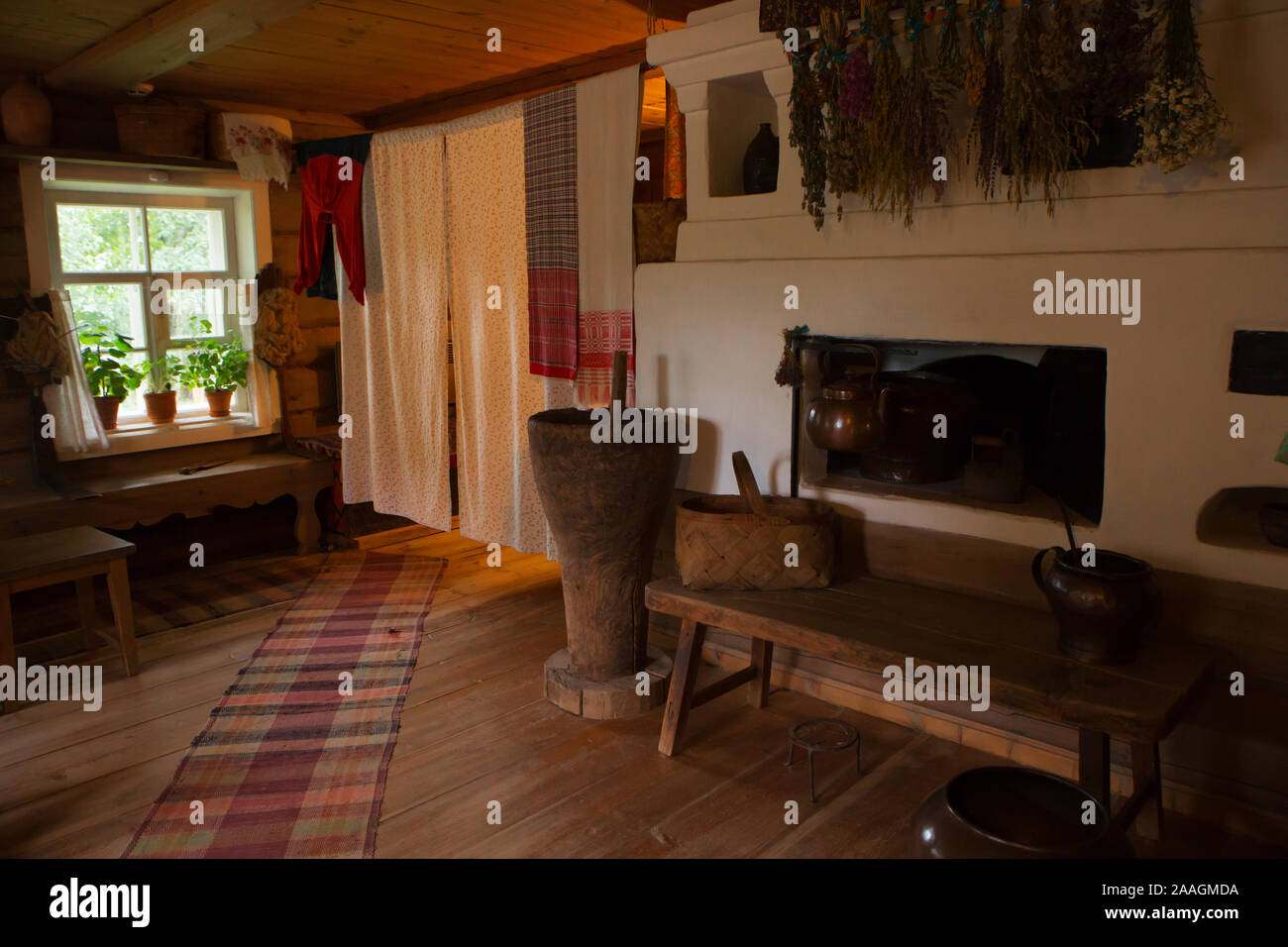The interior of the old Russian log cabin in the Pushkin village of ...
