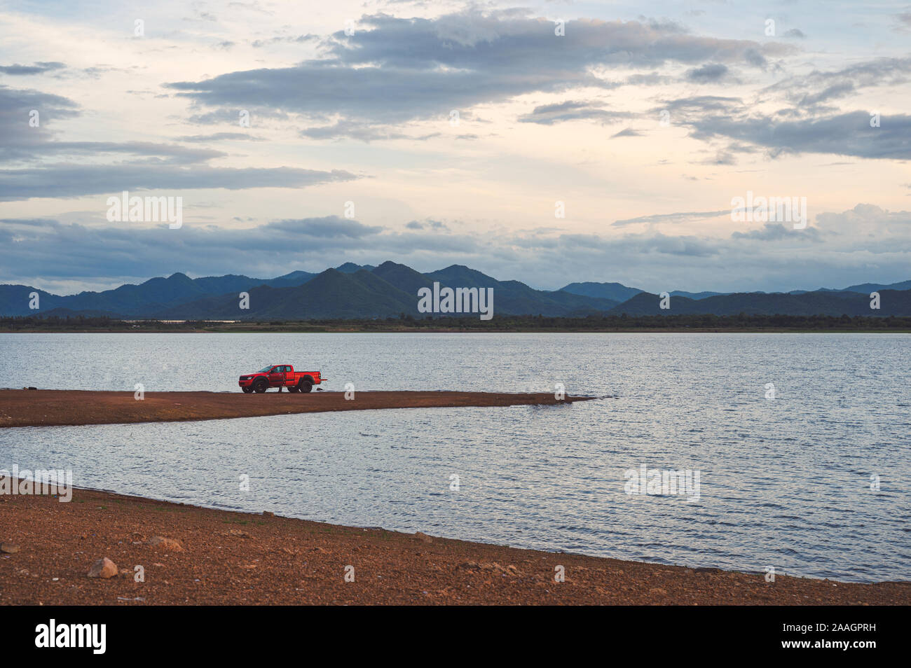 Pickup car parking on ridge of reservoir at evening, Huai Mai Teng ...