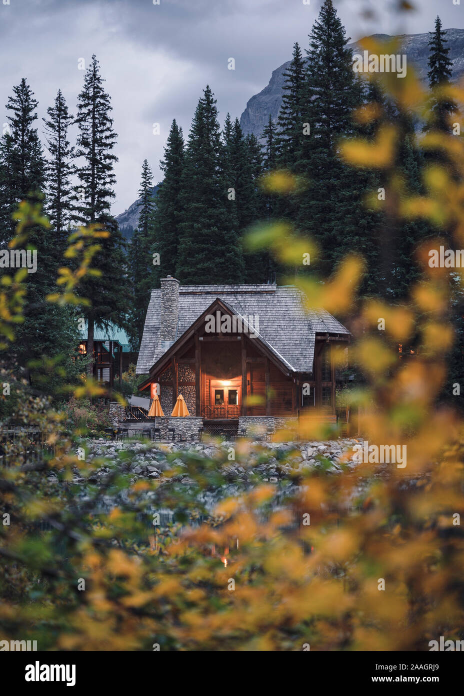 Wooden house with autumn leaves on Emerald lake in Yoho national park ...