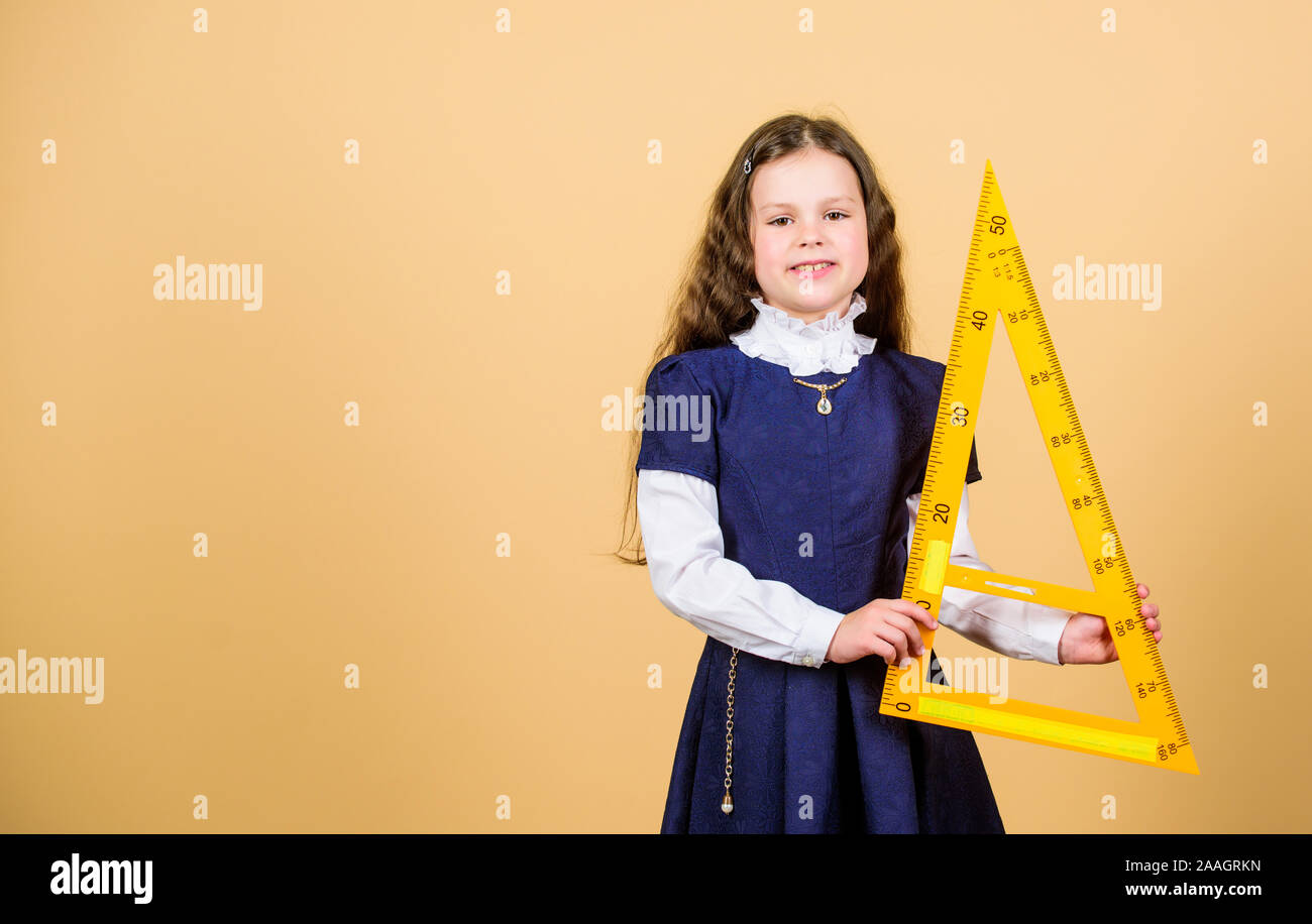 Kid school uniform hold ruler. I love mathematics. Education and school ...