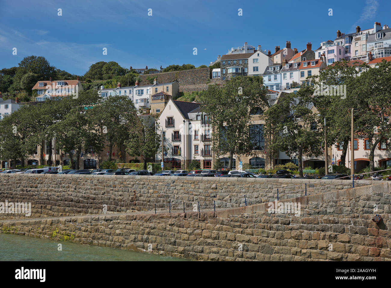ST. PETER PORT, GUERNSEY, UK - AUGUST 16, 2017: Scenic view of a bay in ...