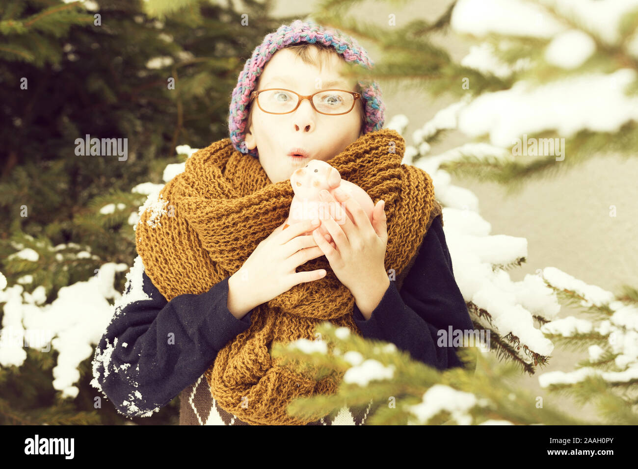 small surprised boy or cute nerd kid in glasses, hat, sweater and ...