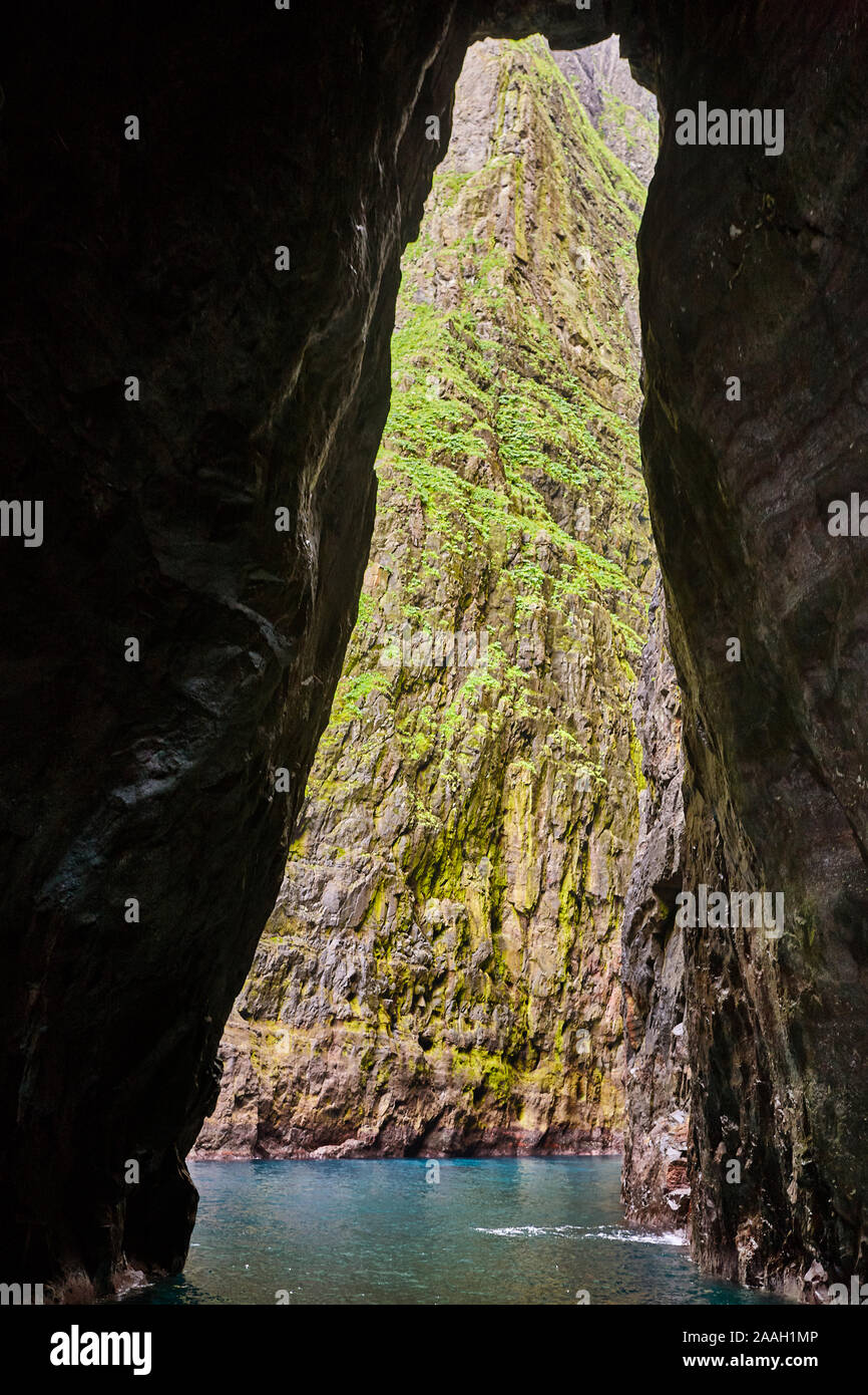 Stunning stone cliffs and caves on atlantic ocean in Faroe islands ...