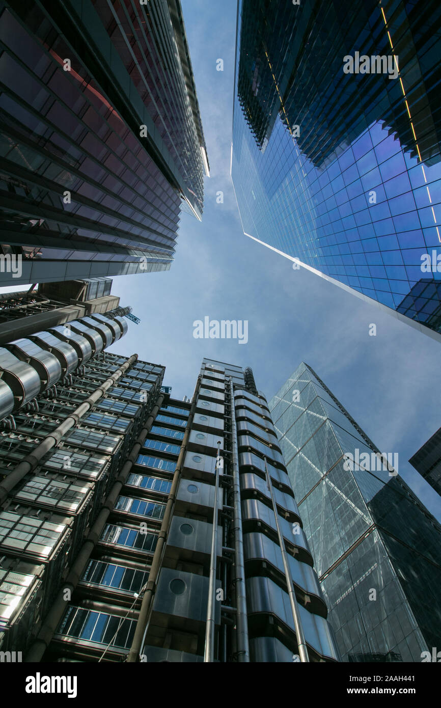 Looking up between the Lloyds Building and Willis Towers Watson ...