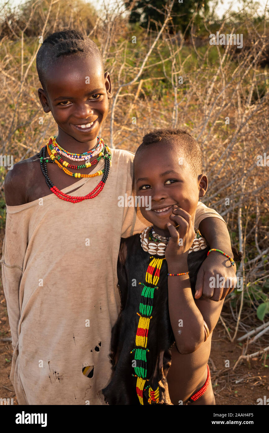 Ethiopia, South Omo, Turmi, Hamar tribal village, smiling young girls ...
