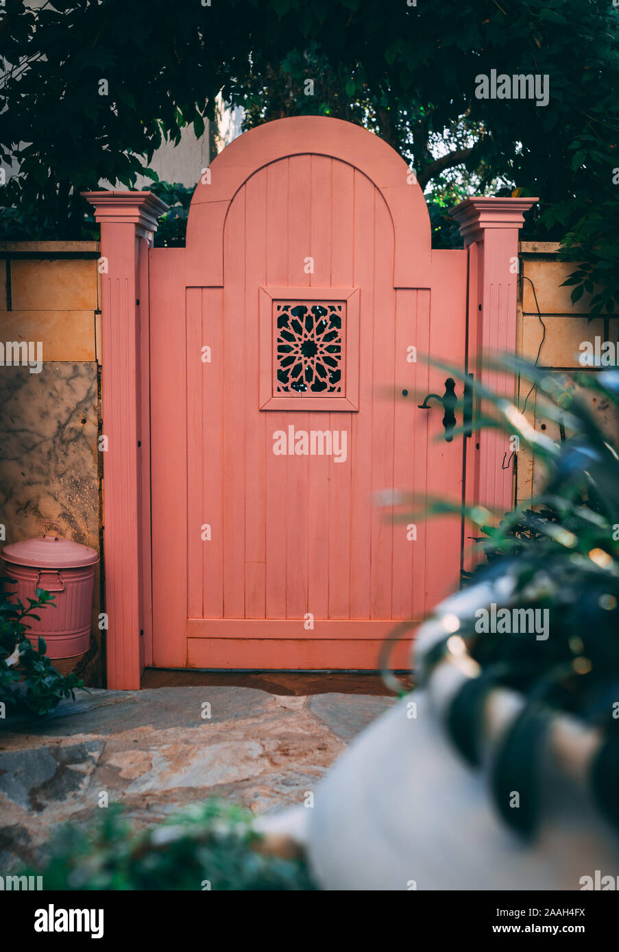 Pink wooden garden gate. Perspective view to garden gate Stock Photo ...