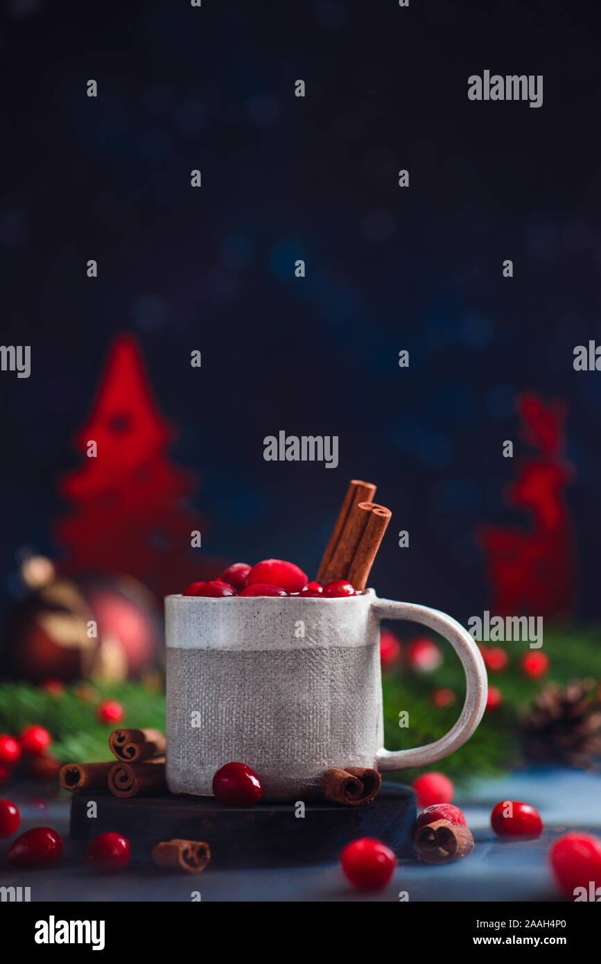 Handmade ceramic cup with a hot cranberry winter drink, Christmas still ...