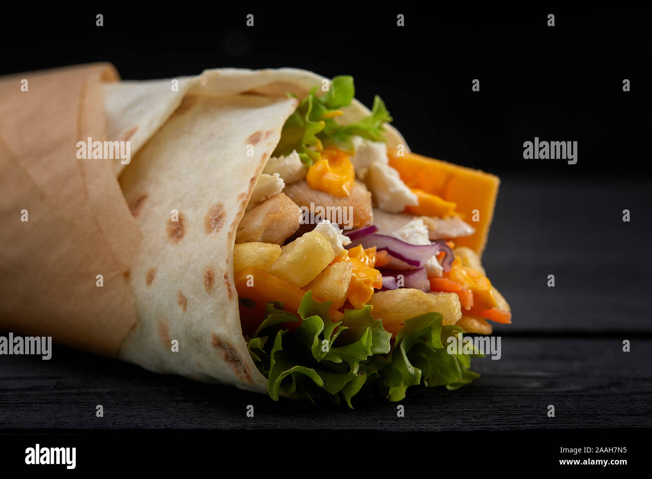 Tasty doner kebabs with fresh salad trimmings and shaved roasted meat ...