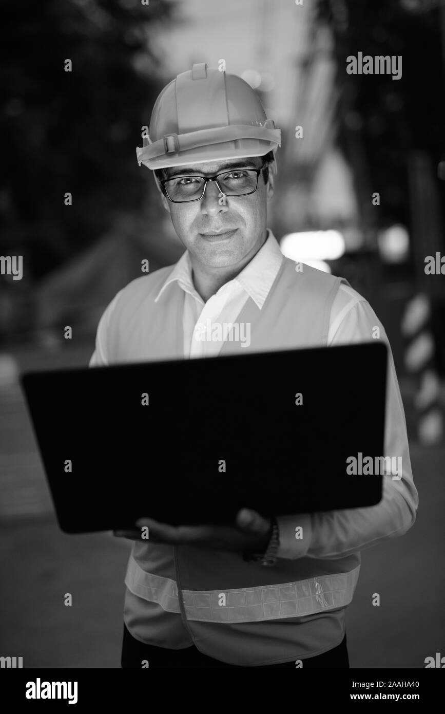 Handsome Persian man construction worker at the construction site at ...
