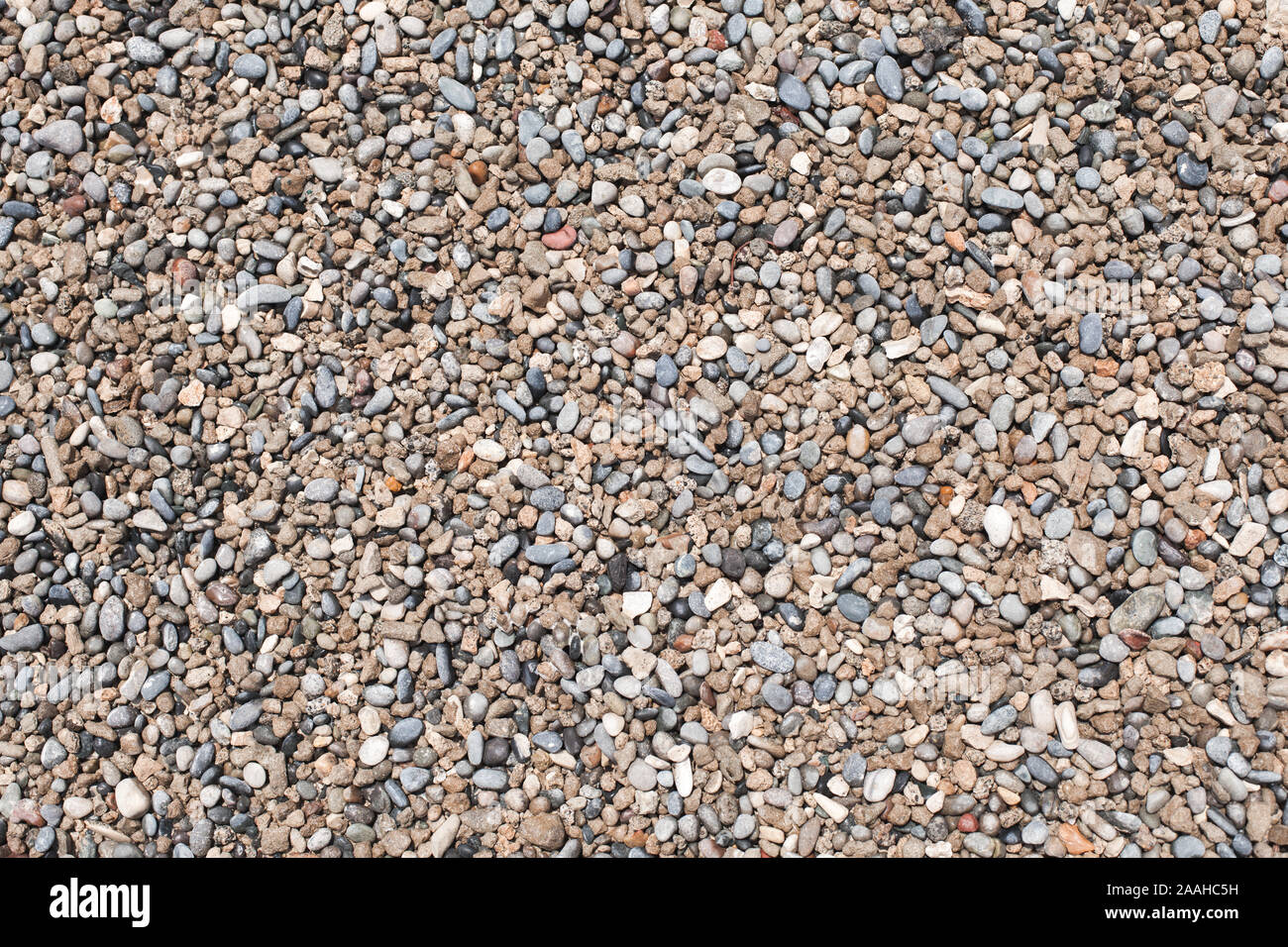 Wet round pebble. Beach ground natural background photo texture. Black ...