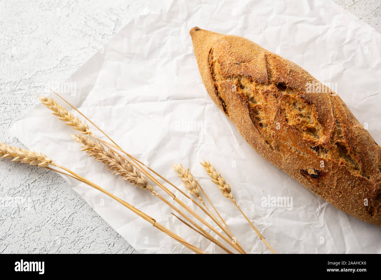 Cereal loaf of bread and wheat, food background Stock Photo - Alamy