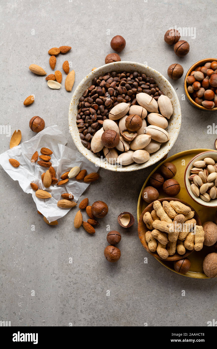 Mixed nuts in different bowls Stock Photo - Alamy