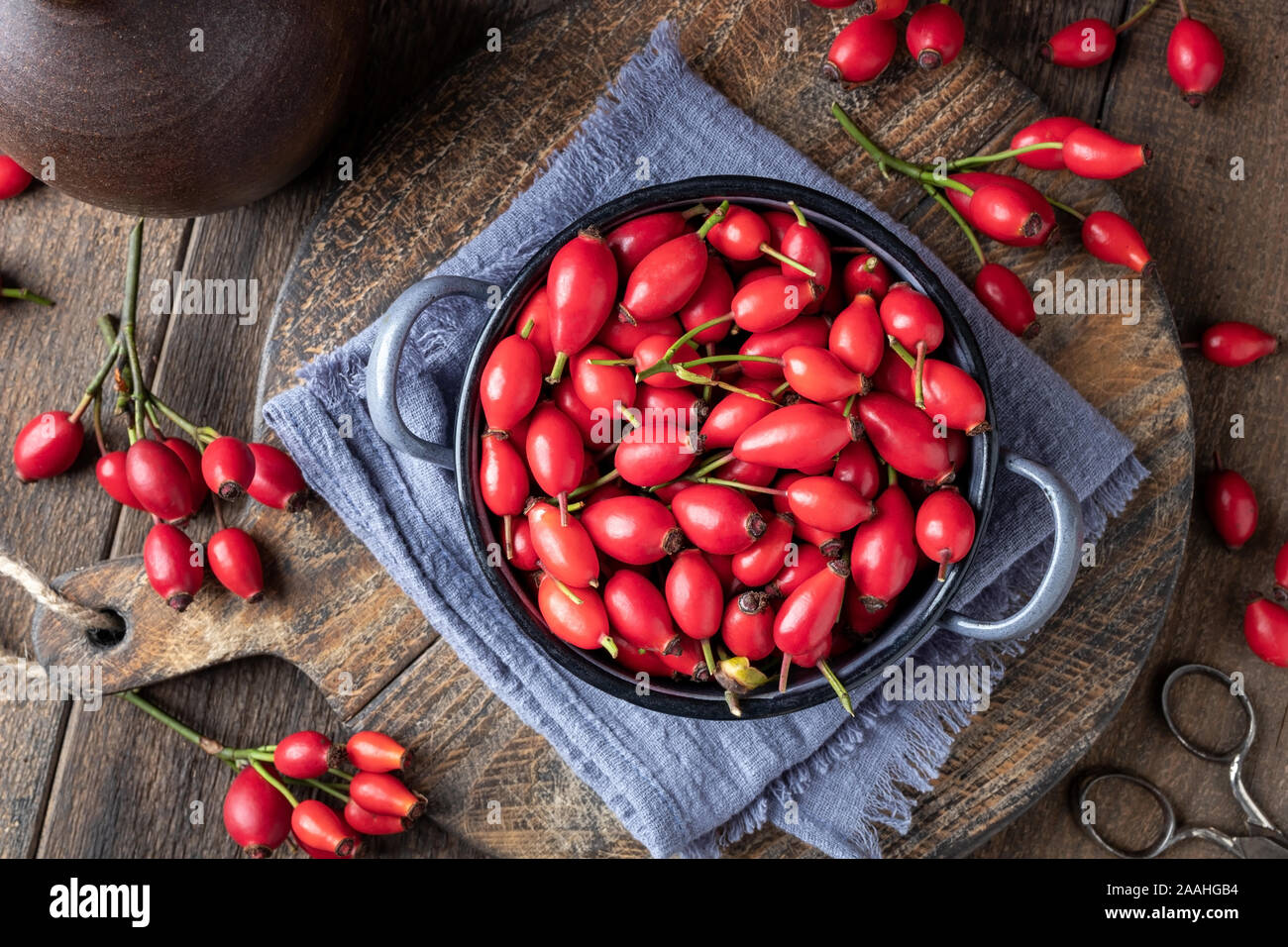 Fresh rose hips on a table, top view Stock Photo - Alamy