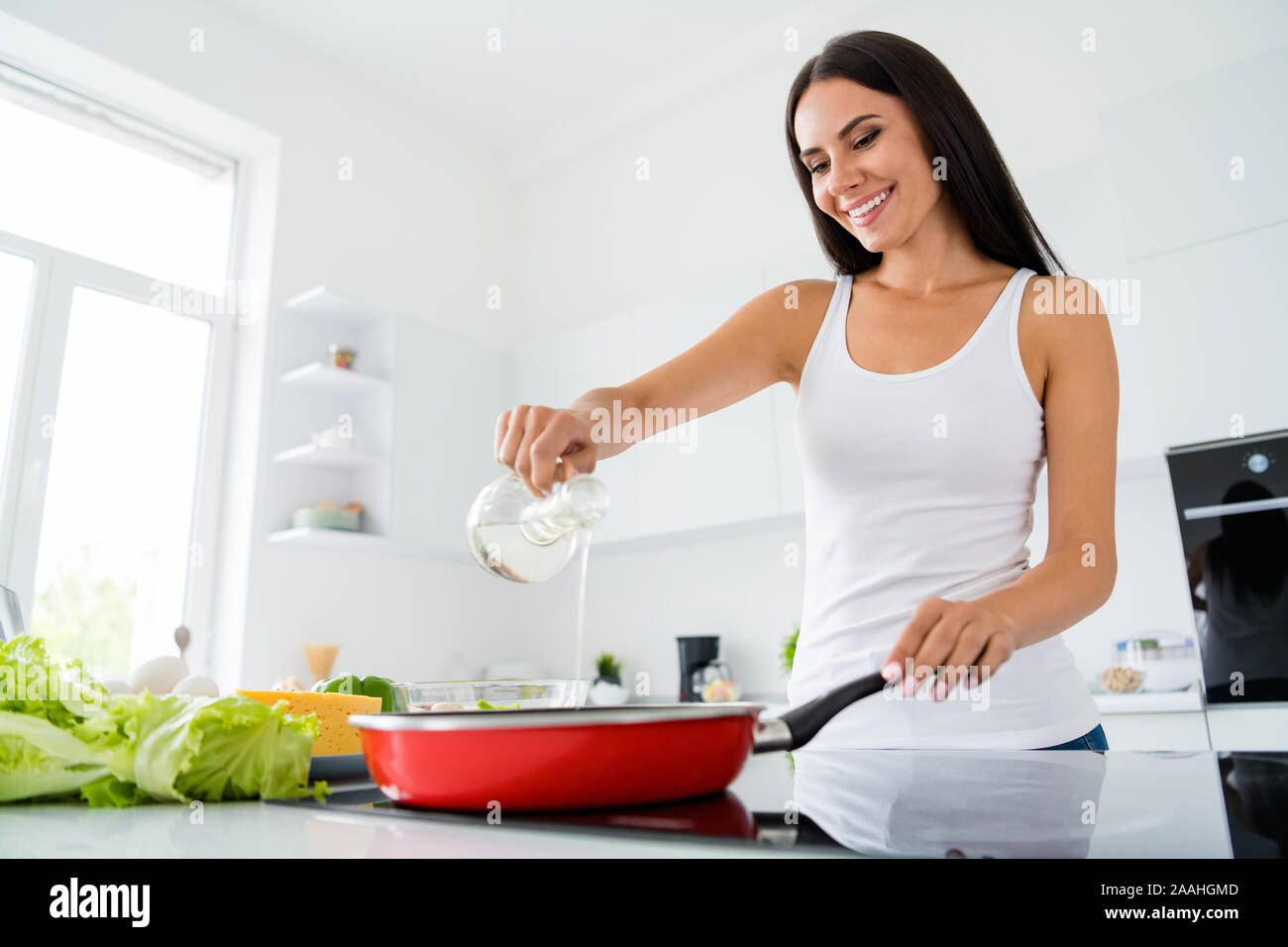 Low angle view photo of positive cheerful girl real chef want cook ...