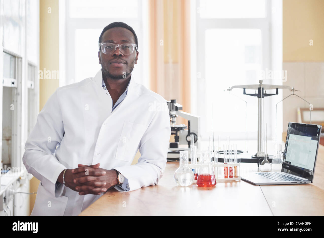 An African American worker works in a laboratory conducting experiments ...