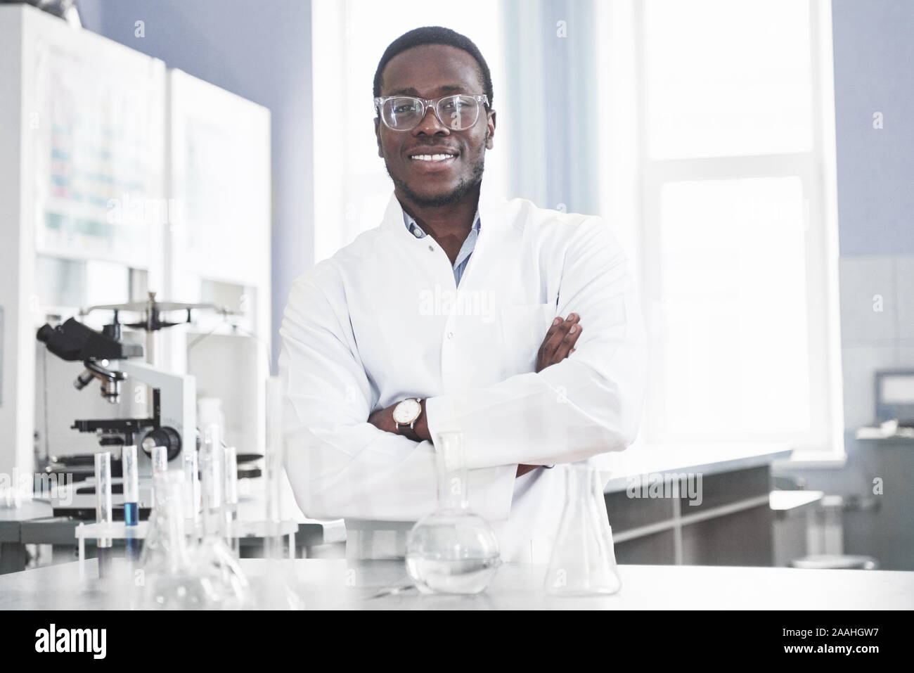 The scientist works with a microscope in a laboratory conducting ...