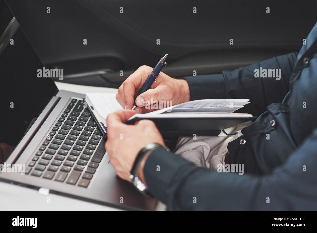 Business Hand Writing Notes car seat Stock Photo - Alamy