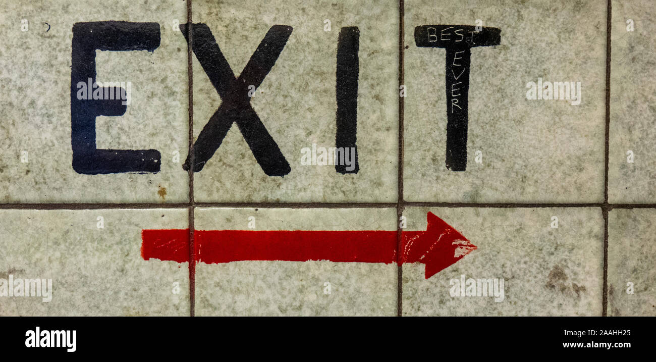 Exit and red arrow painted on a tiled wall in Nicholas Building ...